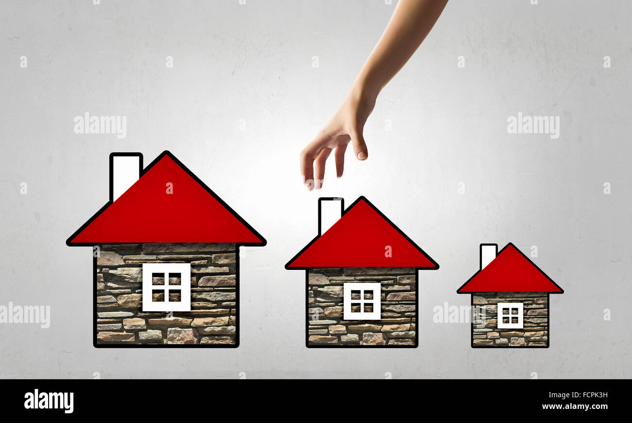 Human hand grabs drawn on paper house Stock Photo - Alamy