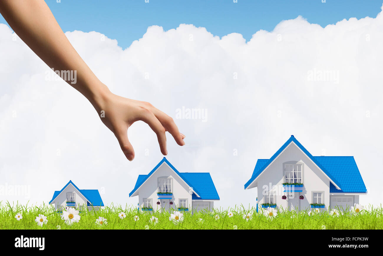 Human hand grabs drawn on paper house Stock Photo - Alamy