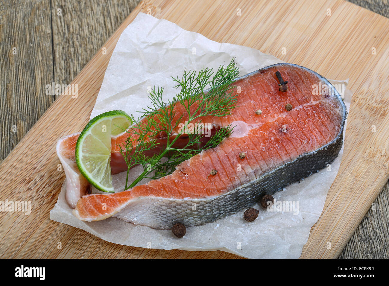 Raw salmon steak with lime and dill ready for cooking Stock Photo - Alamy