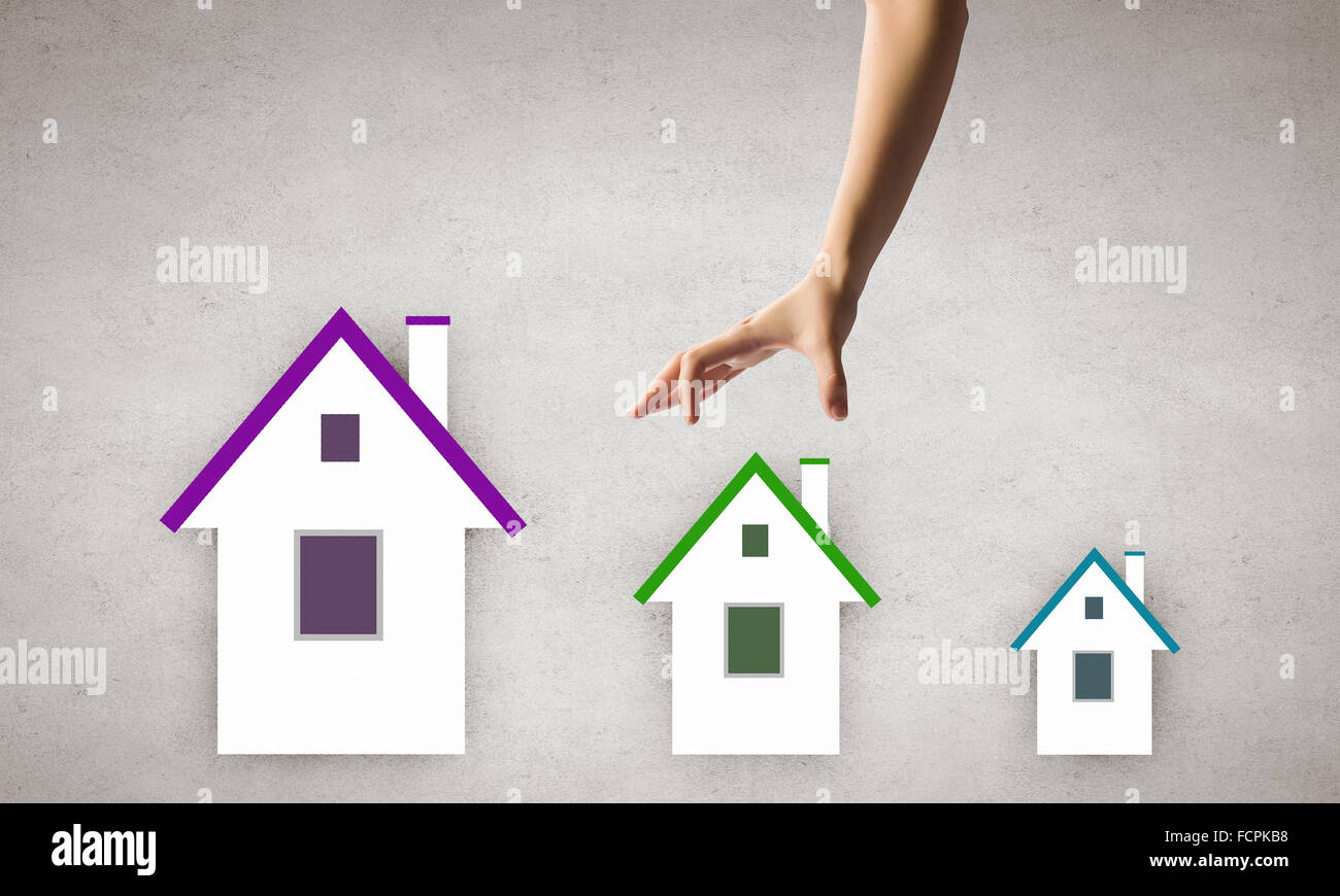 Human hand grabs drawn on paper house Stock Photo - Alamy