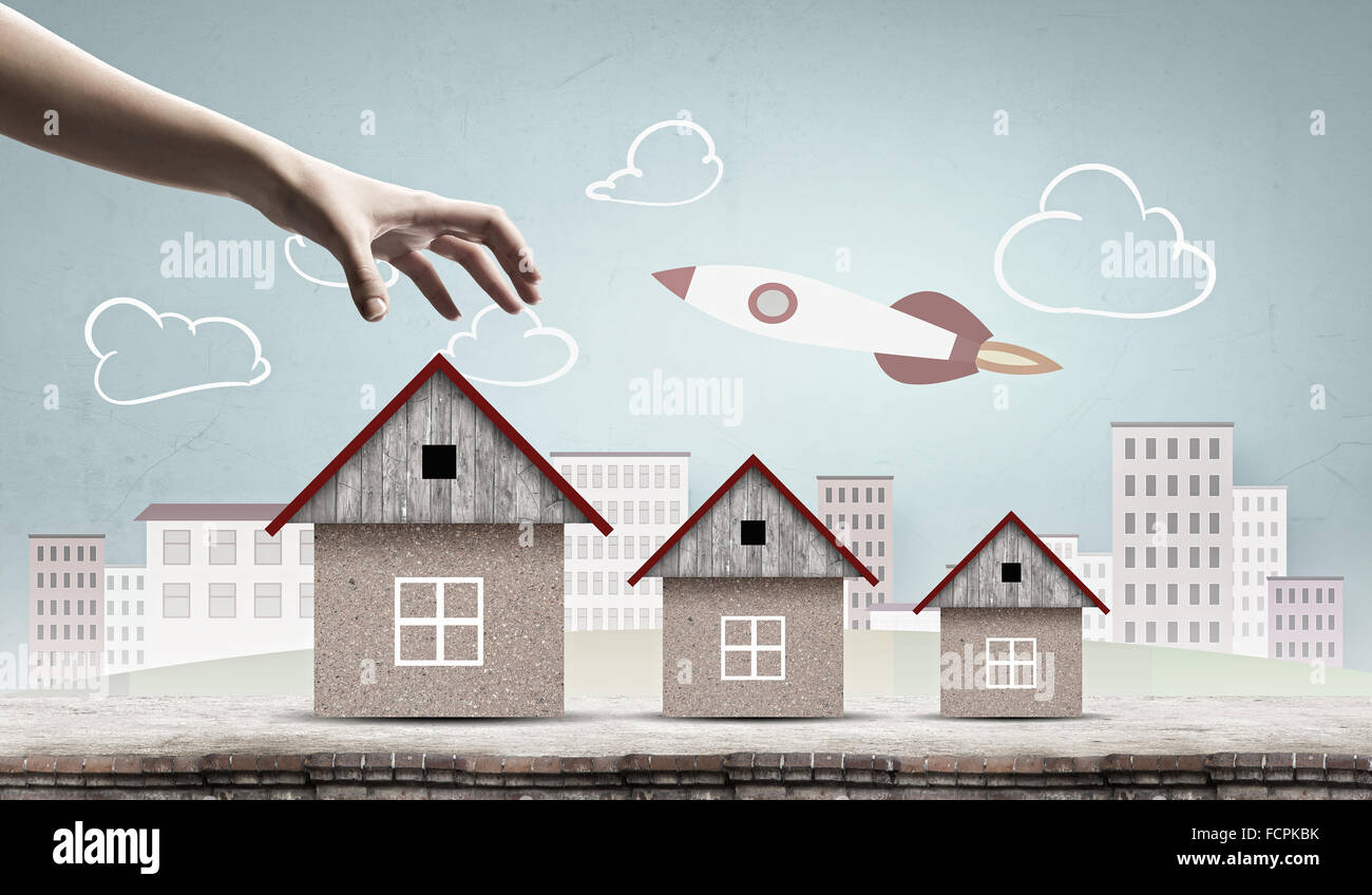 Human hand grabs drawn on paper house Stock Photo - Alamy