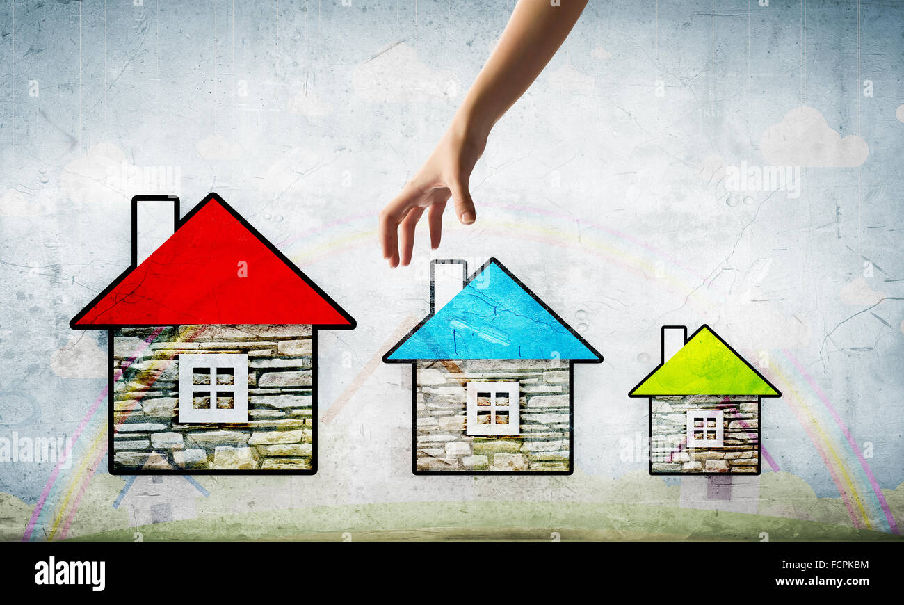 Human hand grabs drawn on paper house Stock Photo - Alamy
