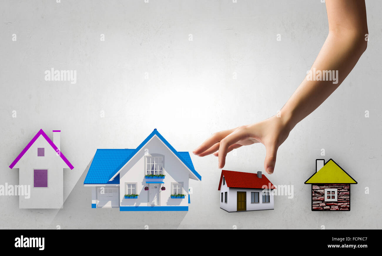 Human hand grabs drawn on paper house Stock Photo - Alamy