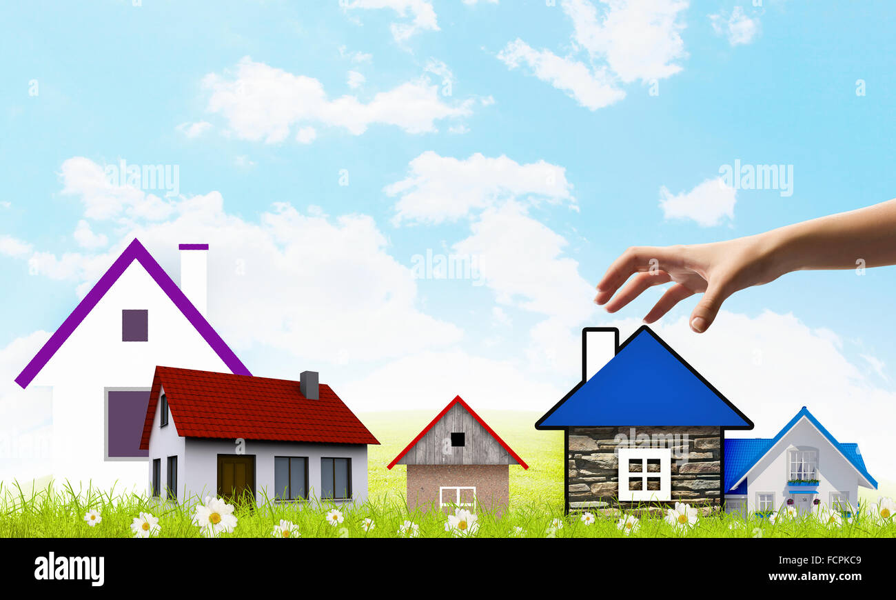 Human hand grabs drawn on paper house Stock Photo - Alamy