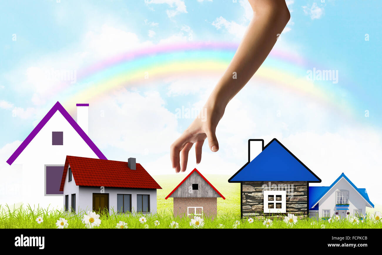 Human hand grabs drawn on paper house Stock Photo - Alamy