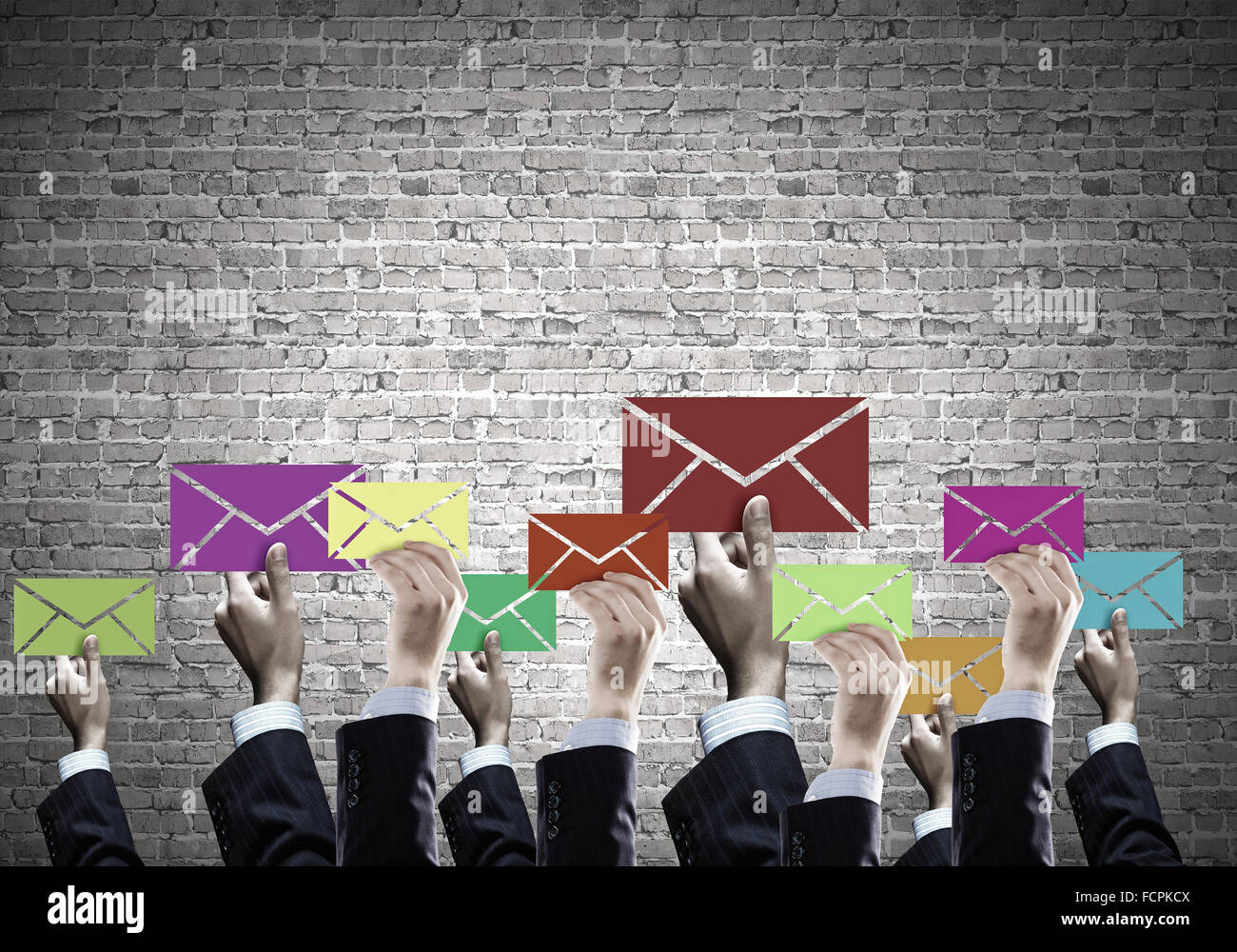 Crowd of businesspeople lifting up hands with conceptual cards Stock ...