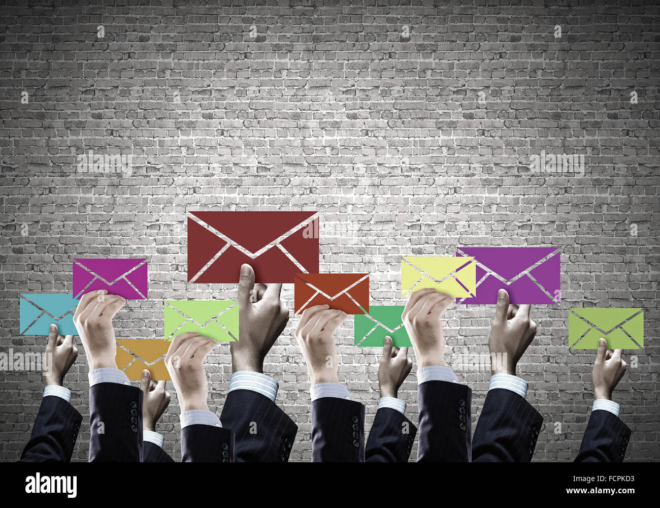 Crowd of businesspeople lifting up hands with conceptual cards Stock ...