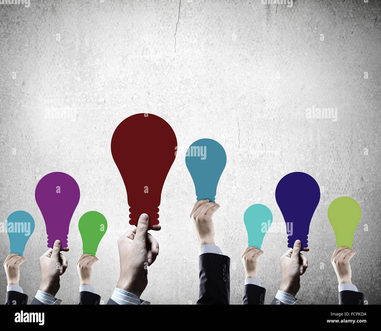 Crowd of businesspeople lifting up hands with conceptual cards Stock ...