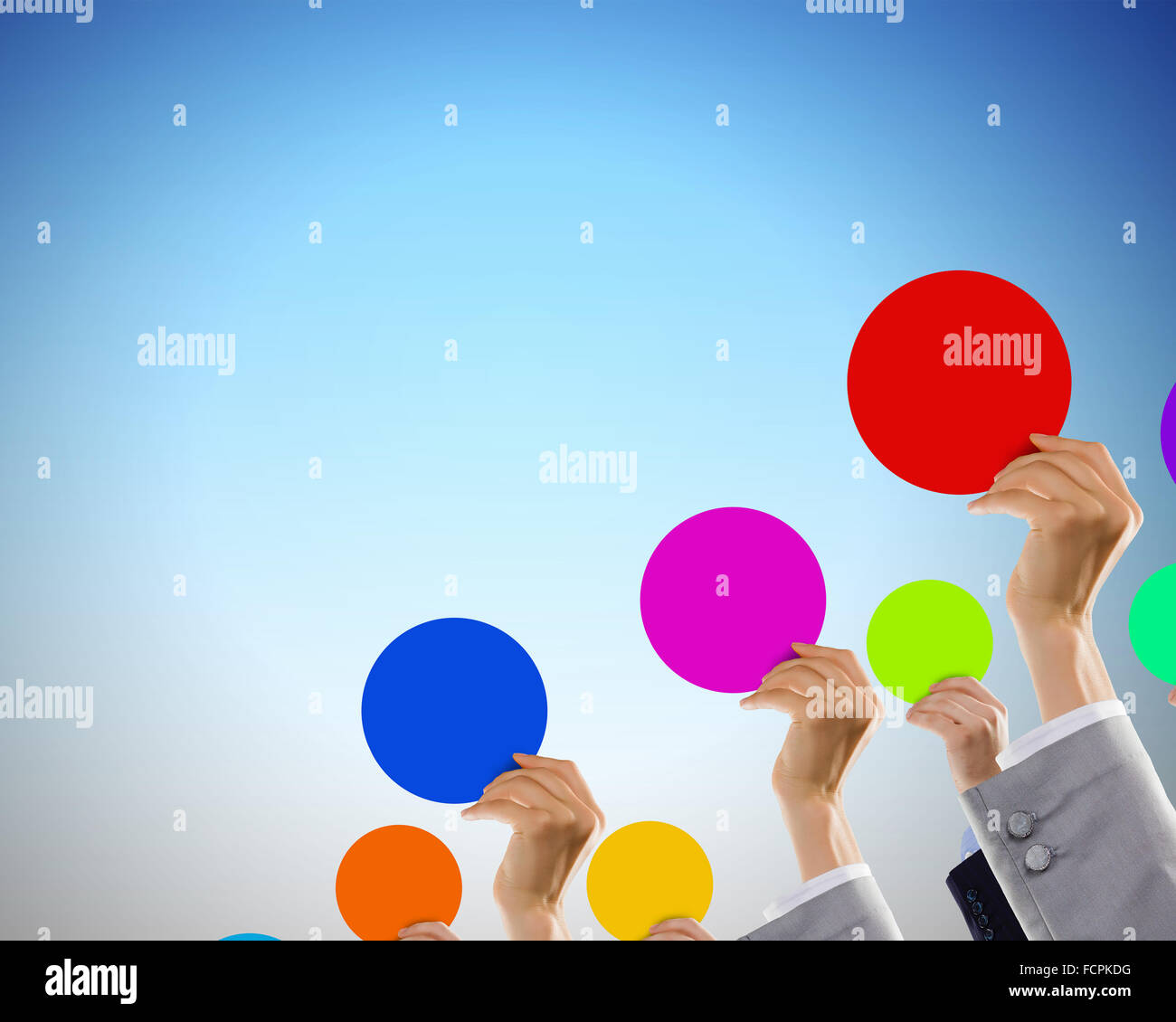 Crowd of businesspeople lifting up hands with conceptual cards Stock ...