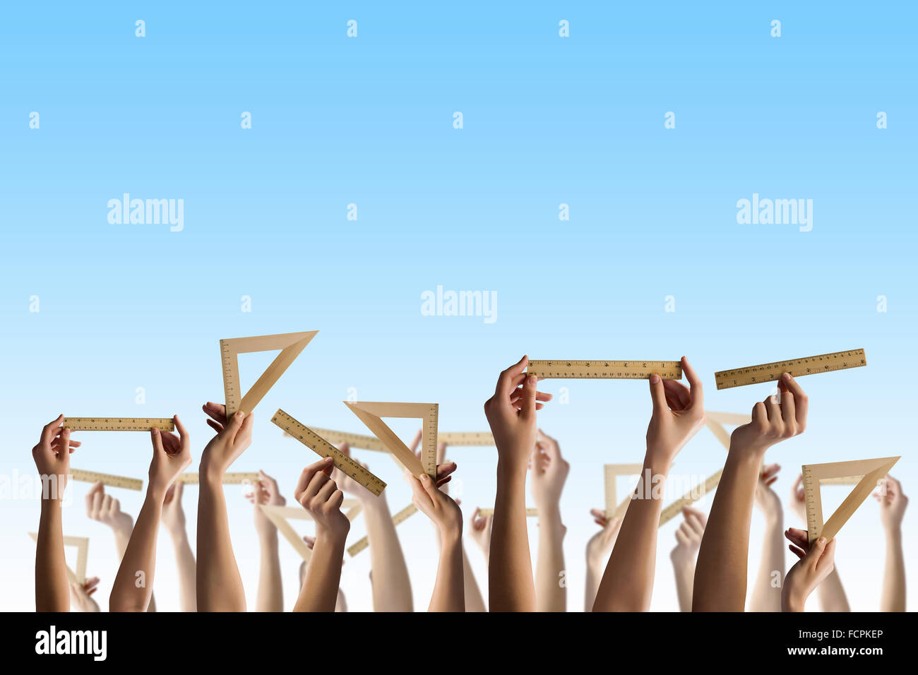 Close up of human hands holding wooden rules Stock Photo - Alamy