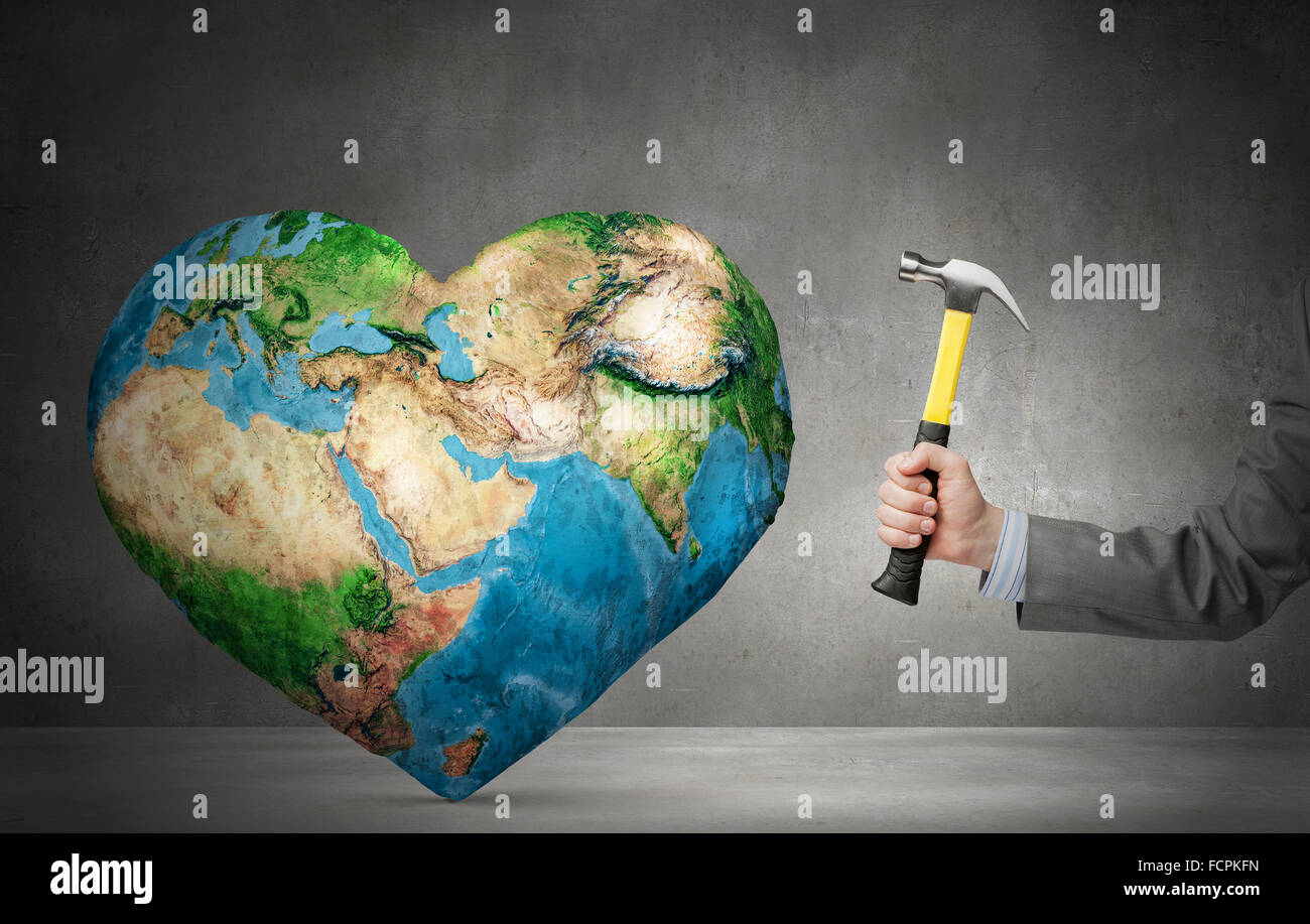 Close up of hammer in human hand hitting Earth planet. Elements of this ...