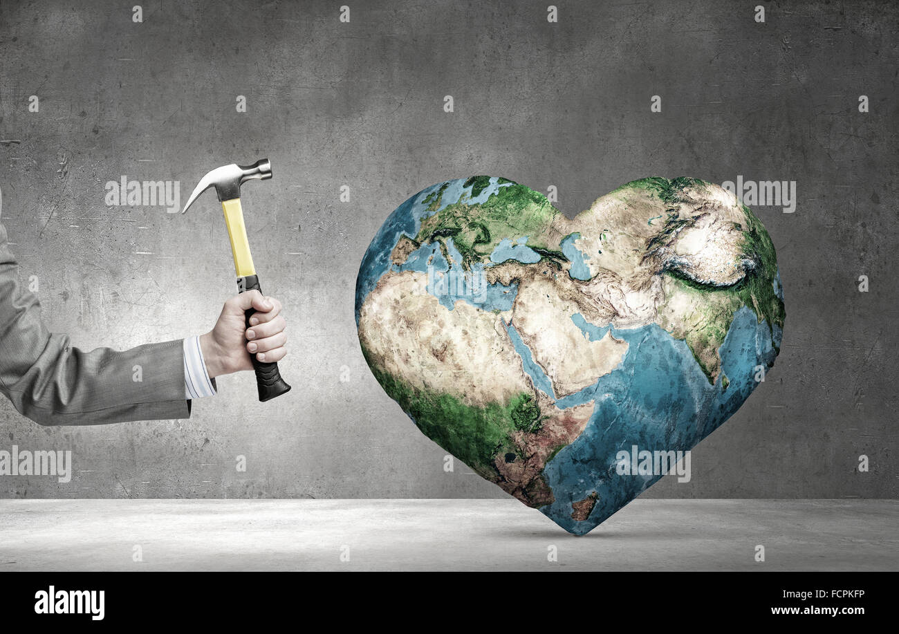 Close up of hammer in human hand hitting Earth planet. Elements of this ...