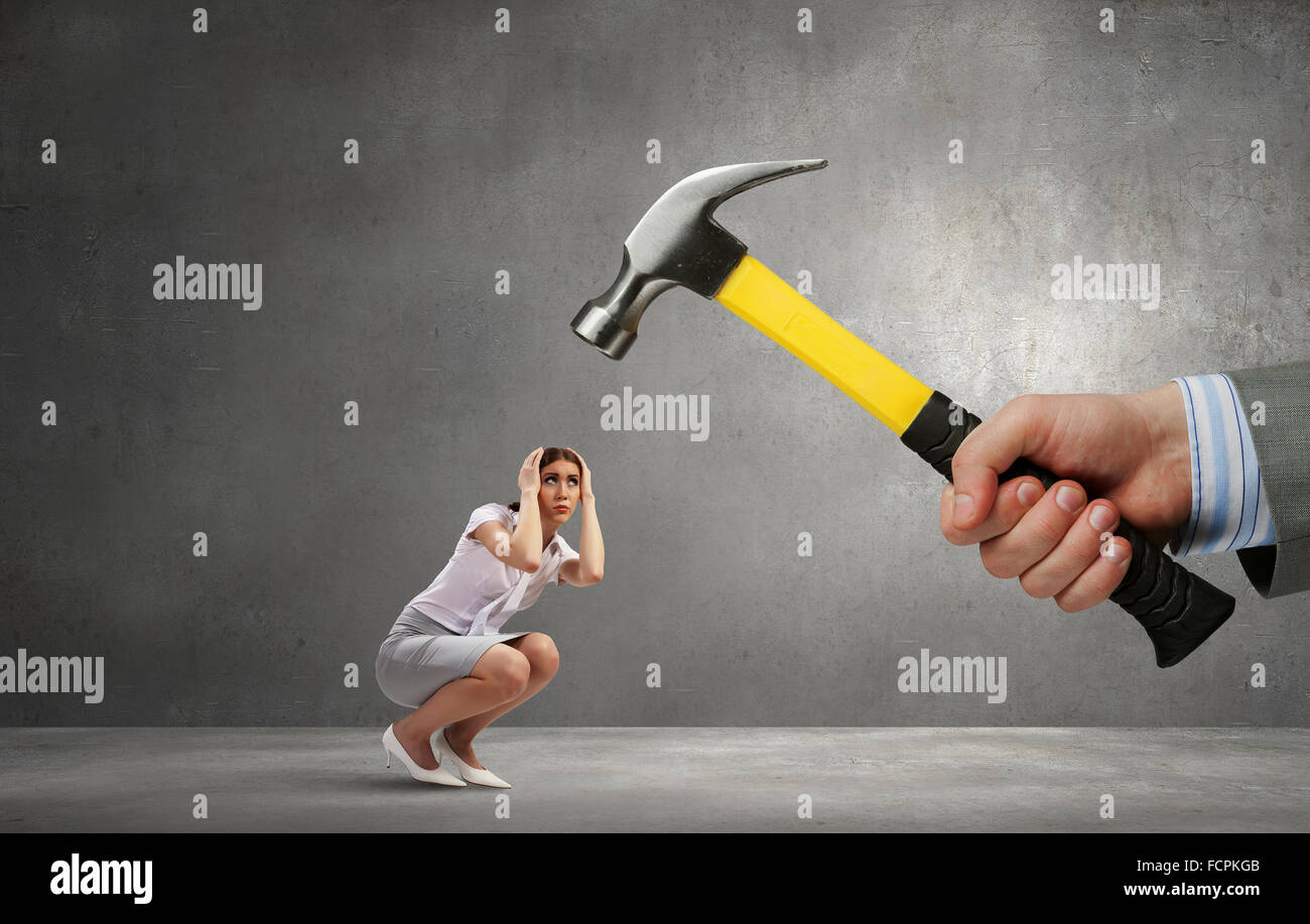 Close up of hammer in male hand attacking scared woman Stock Photo - Alamy