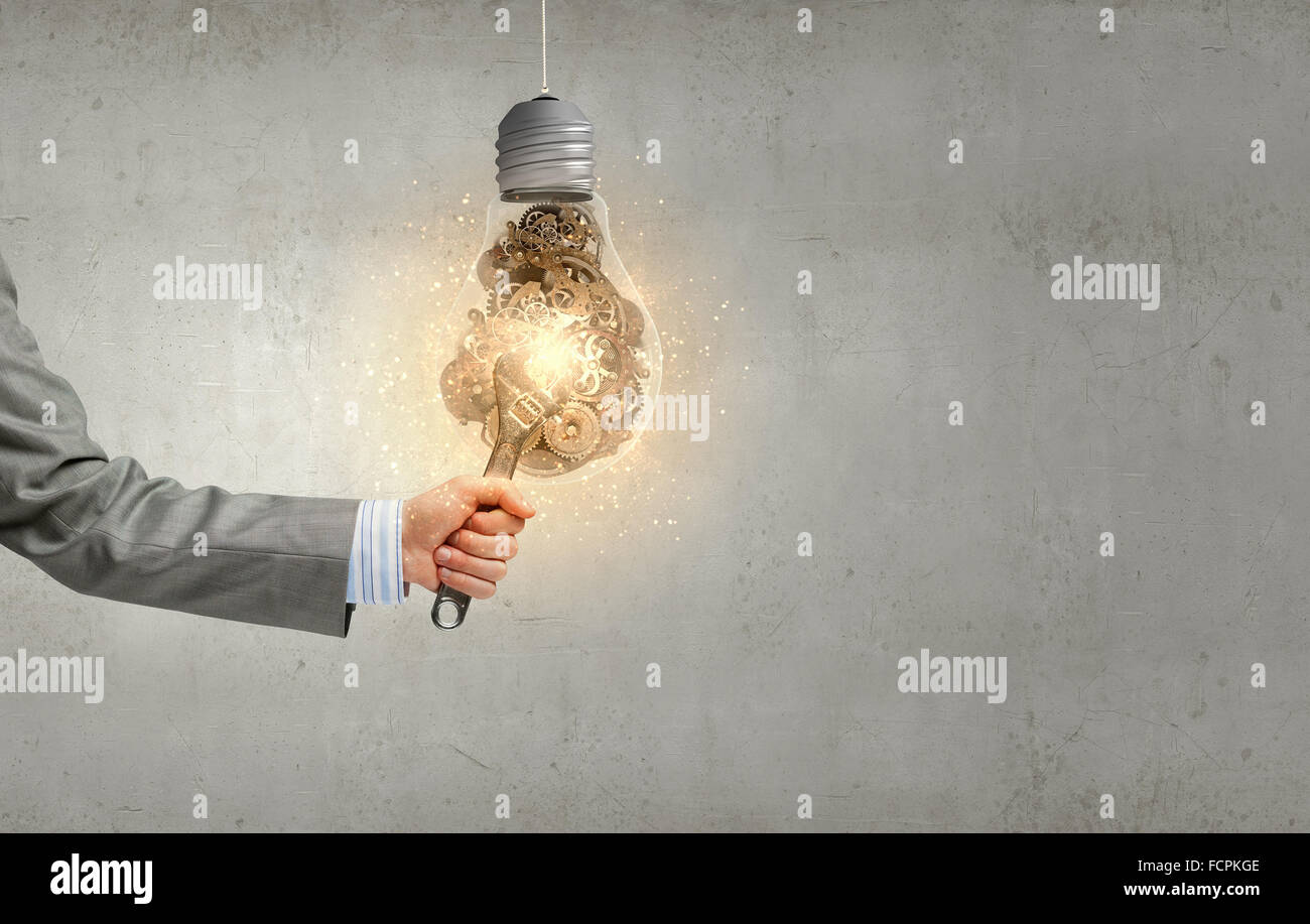 Close up of hand with wrench fixing mechanism Stock Photo - Alamy