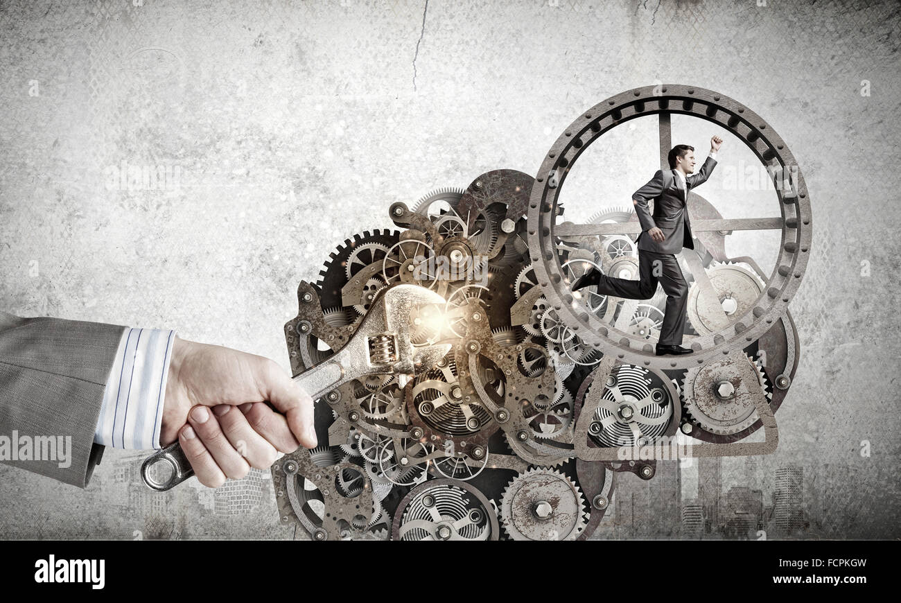 Close up of hand with wrench fixing mechanism Stock Photo - Alamy