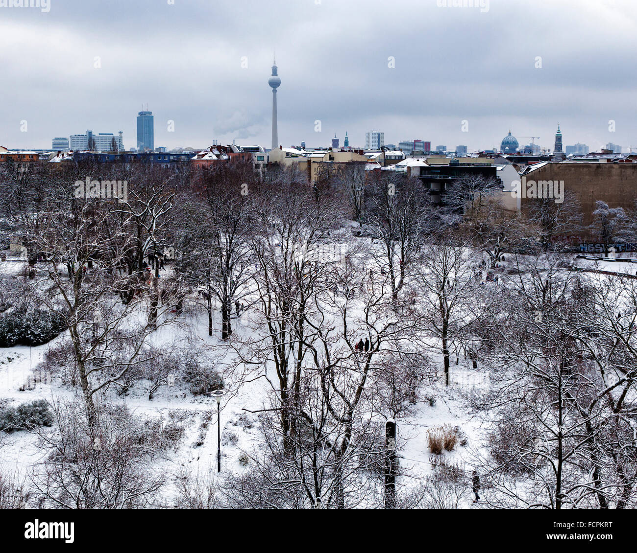 Berlin, Mitte, Snow covered Public park in winter and Berlin Skyline ...