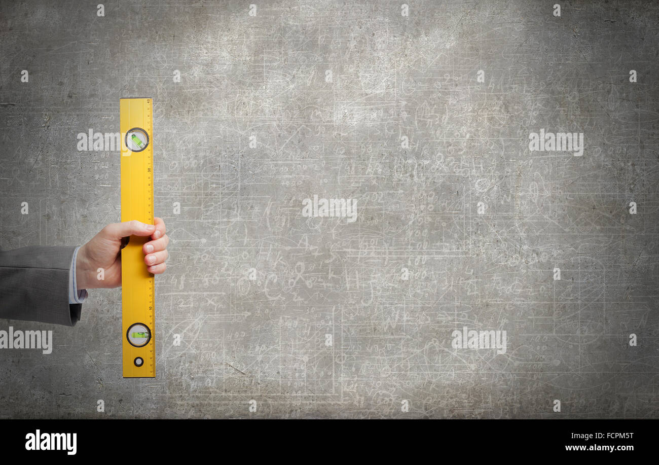 Close up of male hand measuring graph with ruler Stock Photo - Alamy