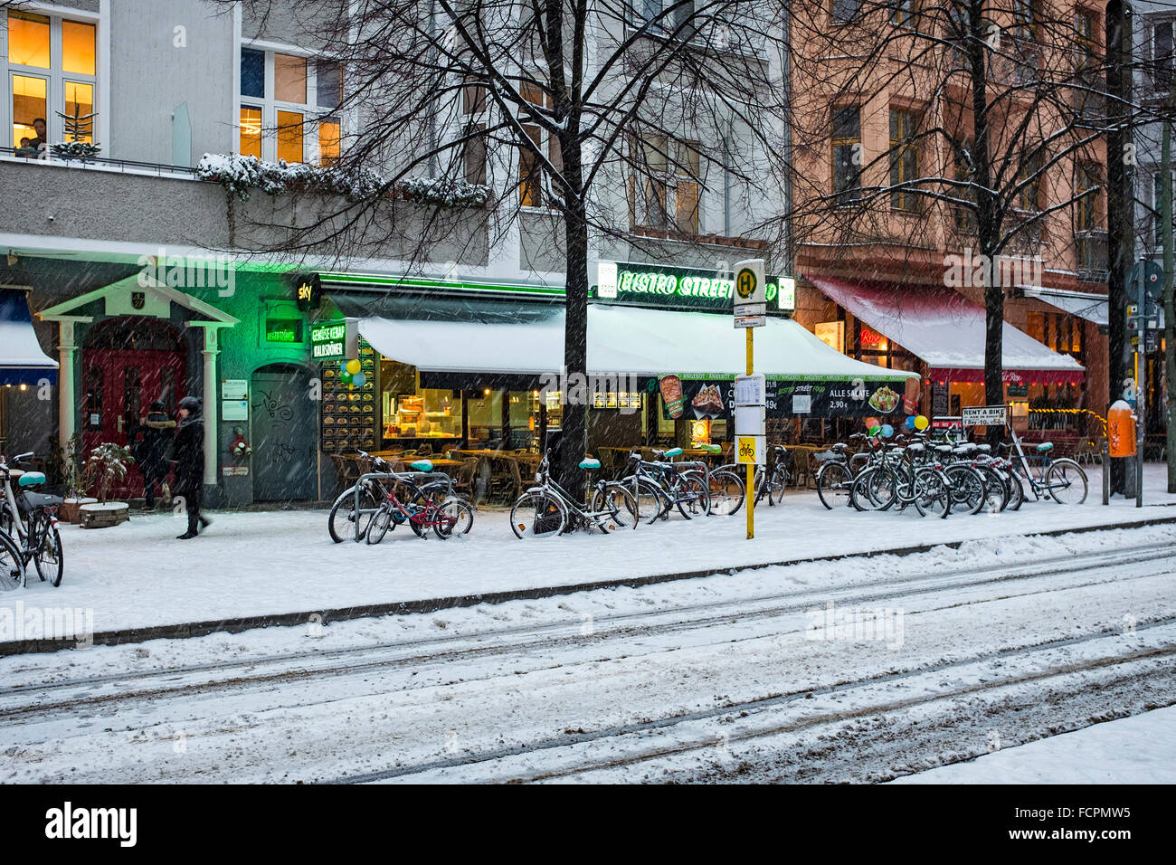 Berlin City Street, Cafe Bistro and tram stop after heavy snow fall in ...