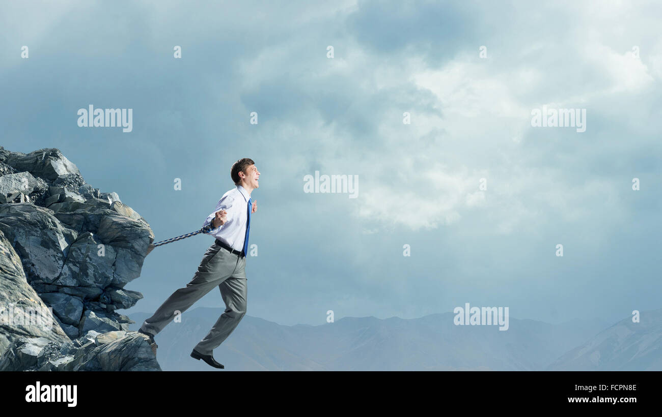 Businessman struggling with problems that occur on the way Stock Photo ...