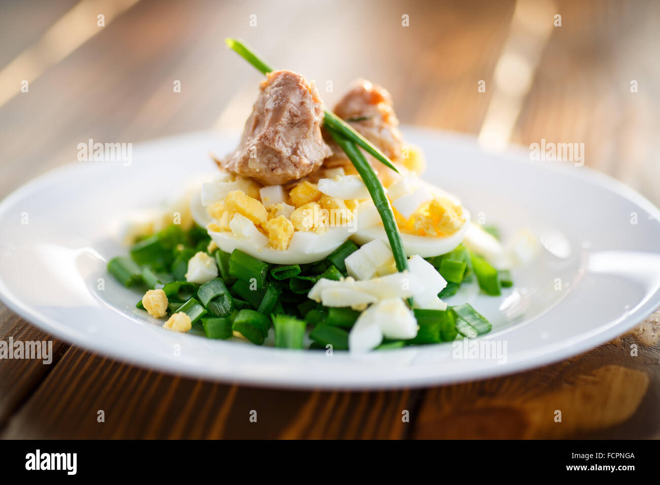 salad with cod liver oil, eggs and green onion Stock Photo - Alamy