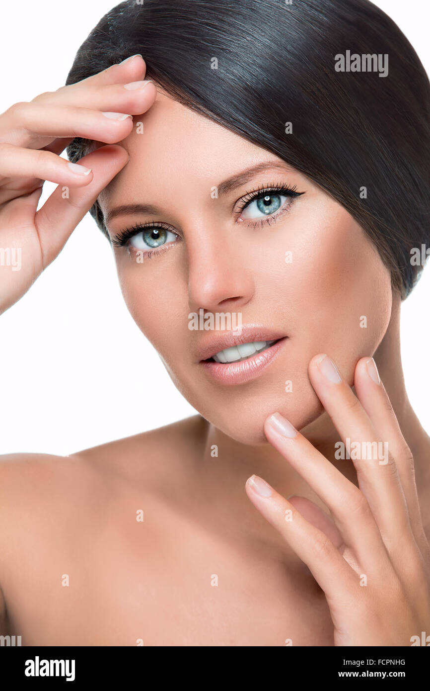 Beautiful girl touching face Stock Photo - Alamy