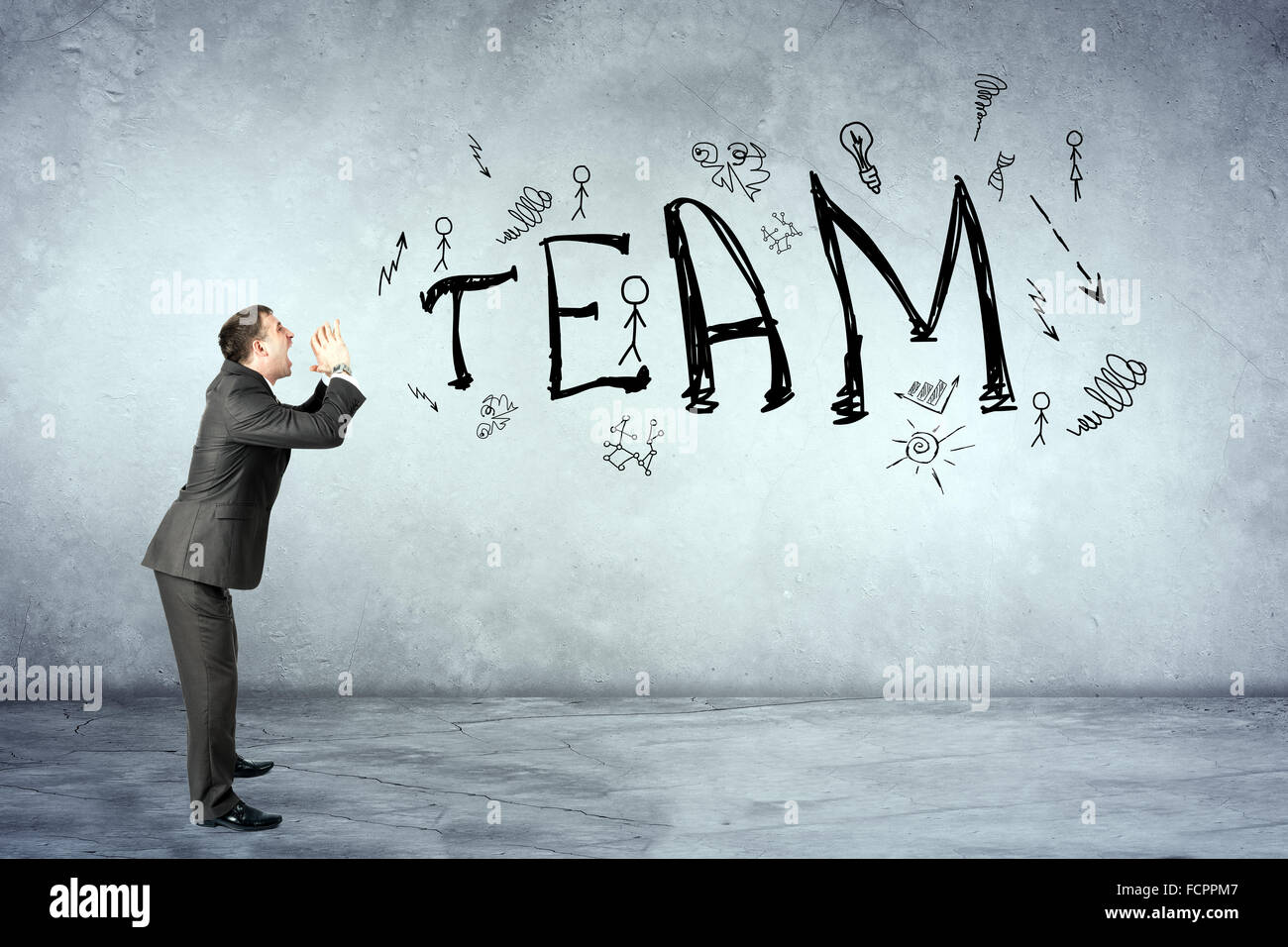 Businessman screaming word team Stock Photo - Alamy