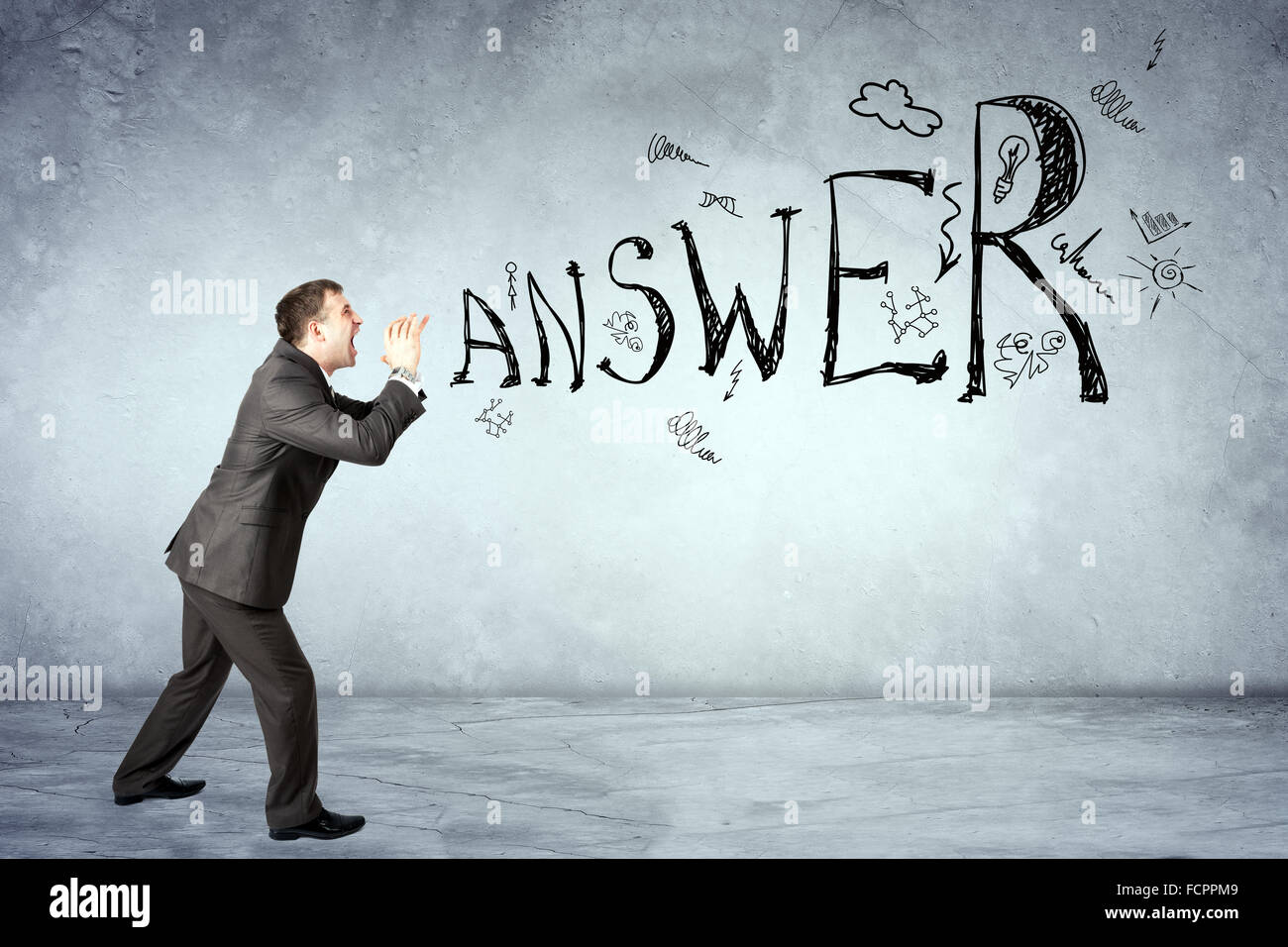 Businessman screaming word answer Stock Photo - Alamy