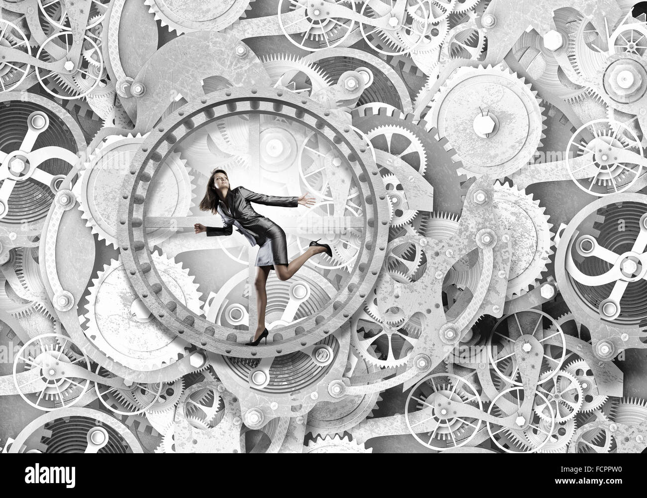 Young businesswoman running in wheel of gears mechanism Stock Photo - Alamy