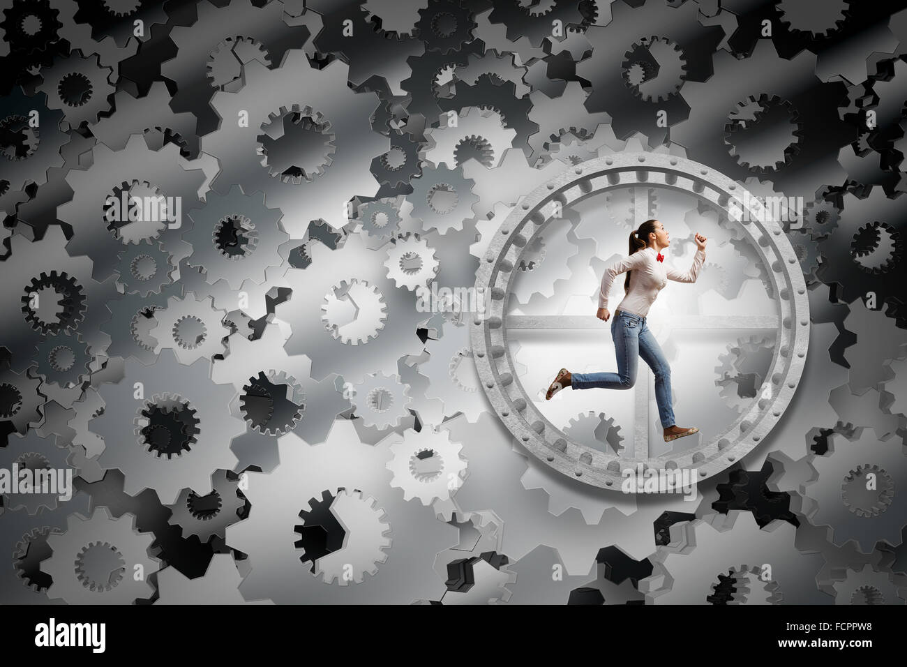 Young businesswoman running in wheel of gears mechanism Stock Photo - Alamy
