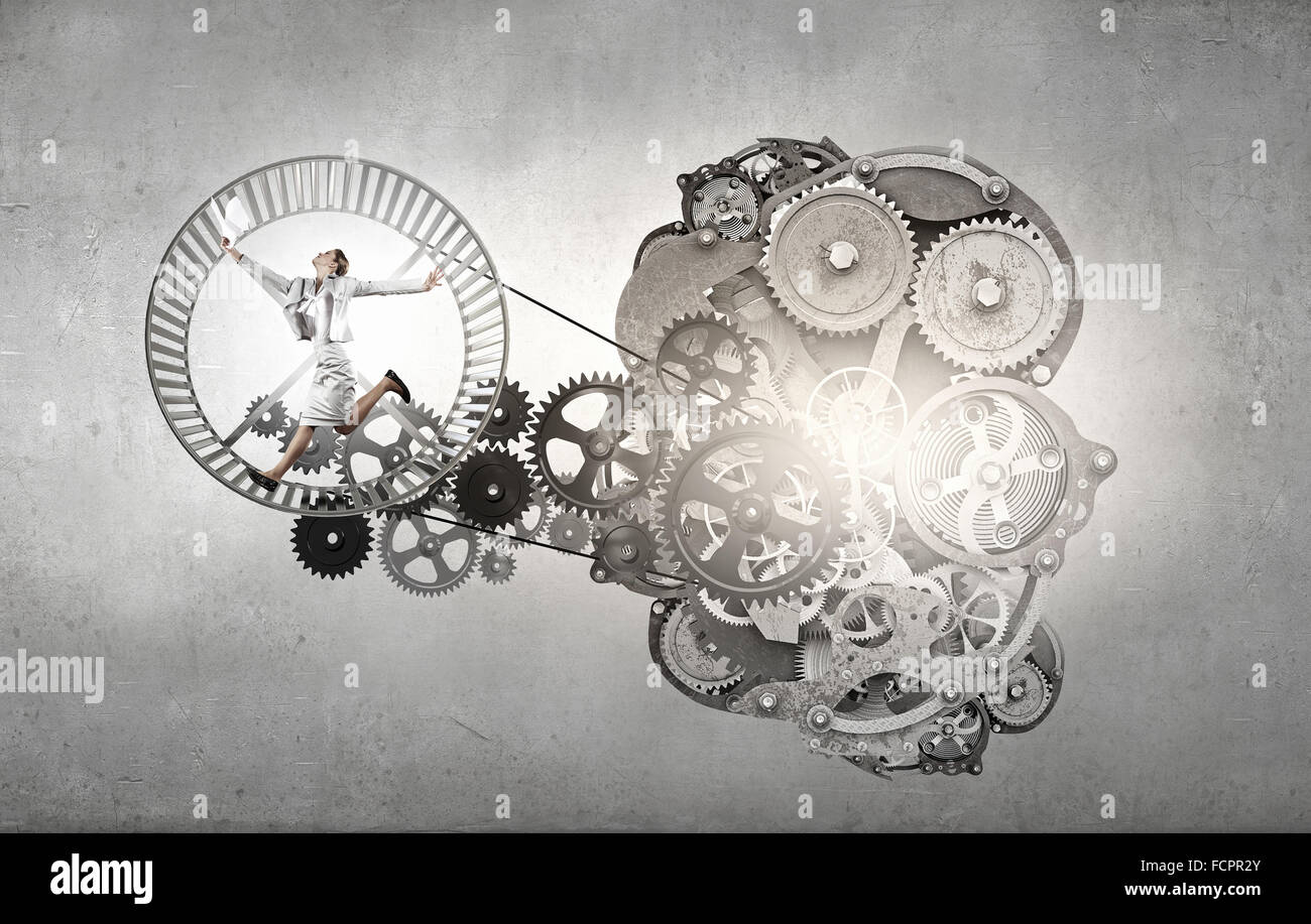 Young businesswoman running in wheel of gears mechanism Stock Photo - Alamy