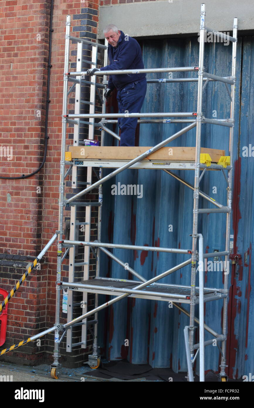 Working from scaffold tower hi-res stock photography and images - Alamy