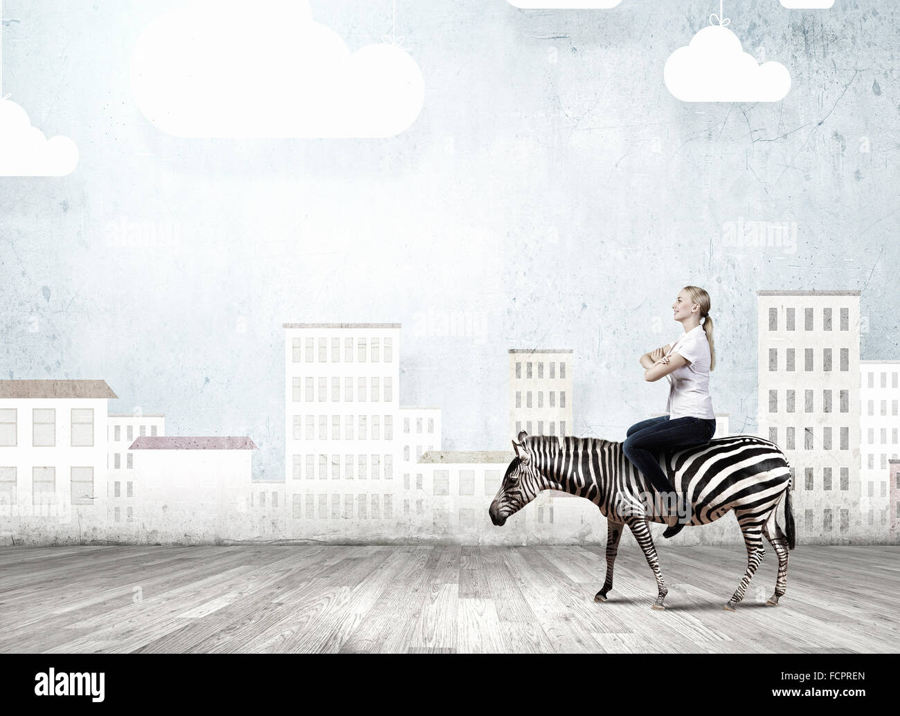 Young pretty fearless woman riding zebra animal Stock Photo - Alamy