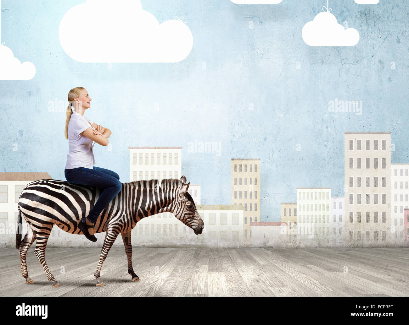 Young pretty fearless woman riding zebra animal Stock Photo - Alamy