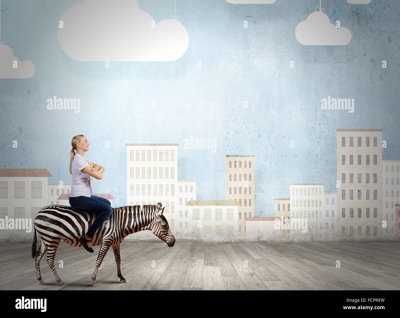 Young pretty fearless woman riding zebra animal Stock Photo - Alamy
