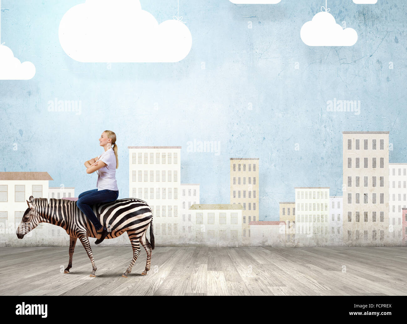 Young pretty fearless woman riding zebra animal Stock Photo - Alamy