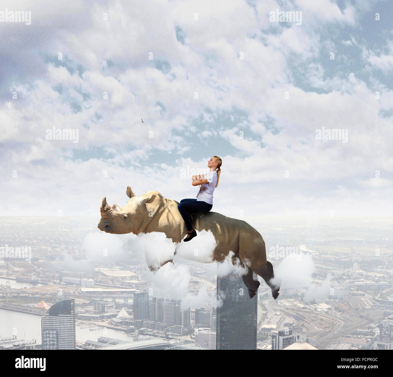 Young pretty fearless woman riding huge flying Stock Photo - Alamy