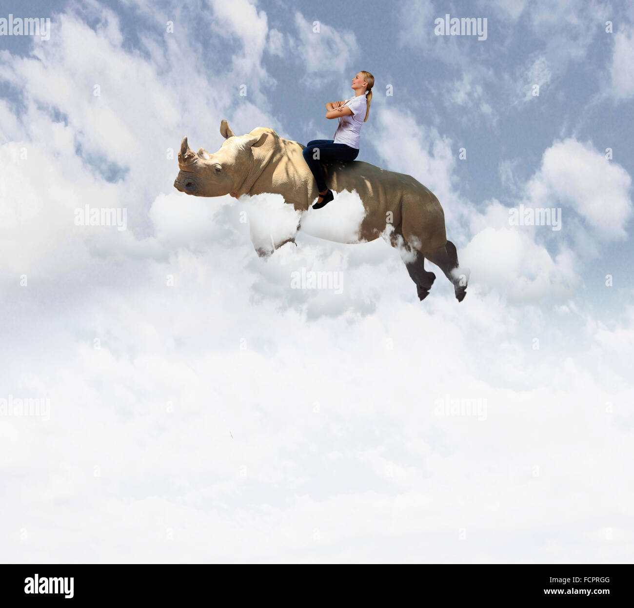 Young pretty fearless woman riding huge flying Stock Photo - Alamy