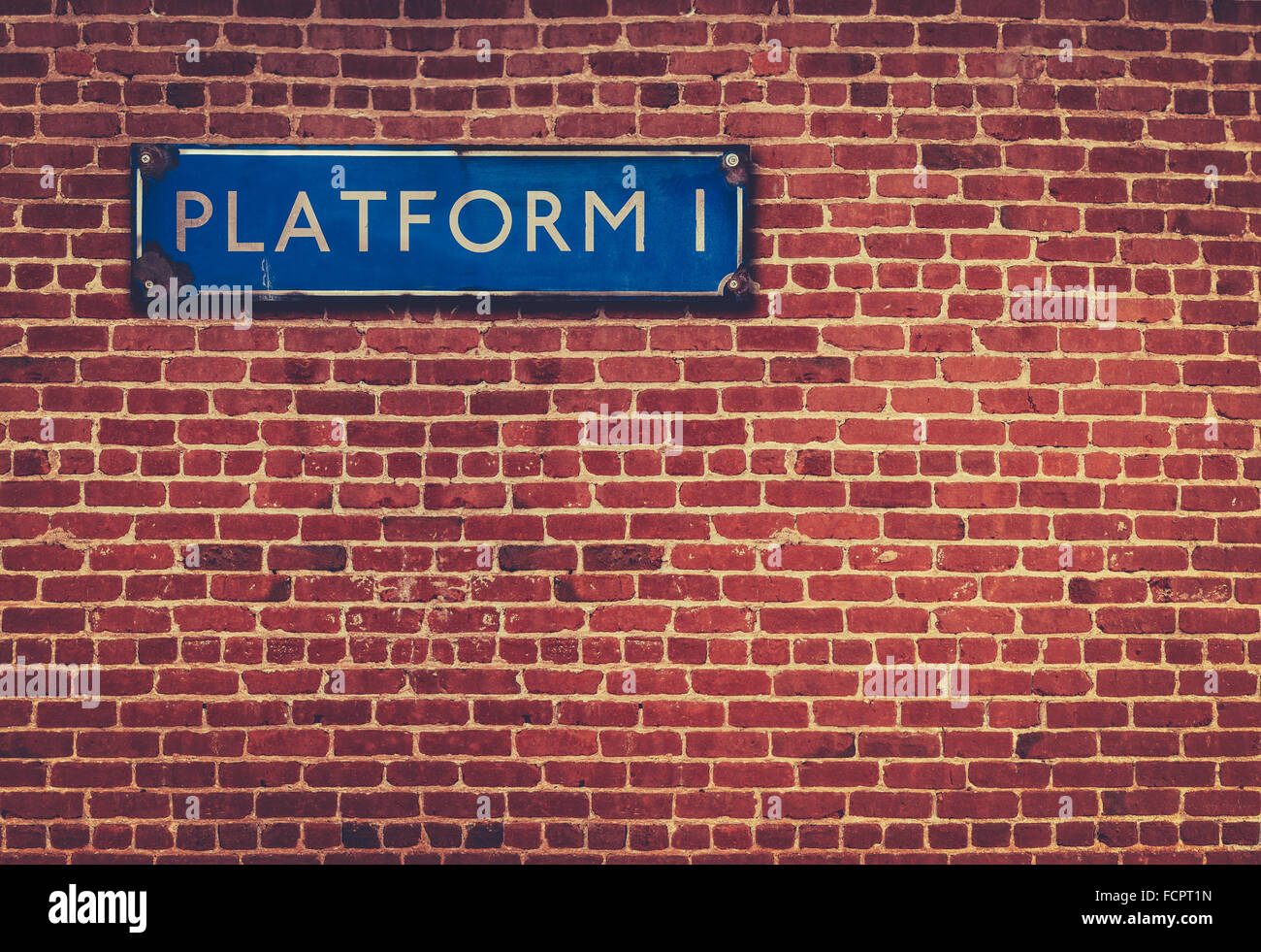 Retro British Railway Platform Sign Against A Red Brick Wall Stock ...