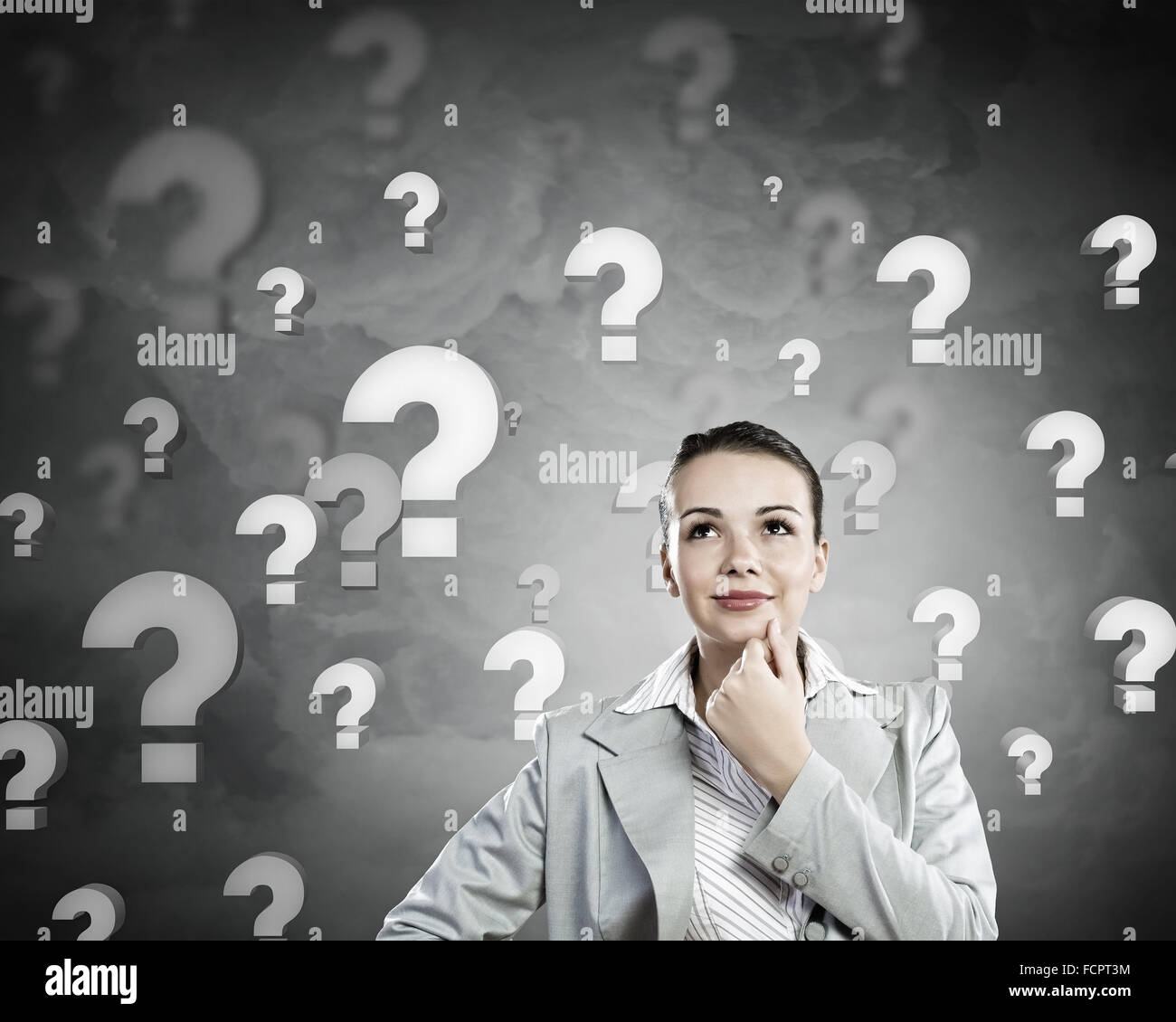 Young pretty businesswoman with question mark over head Stock Photo - Alamy