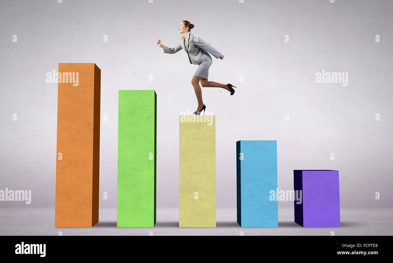 Young businesswoman stepping up on chart bar Stock Photo - Alamy