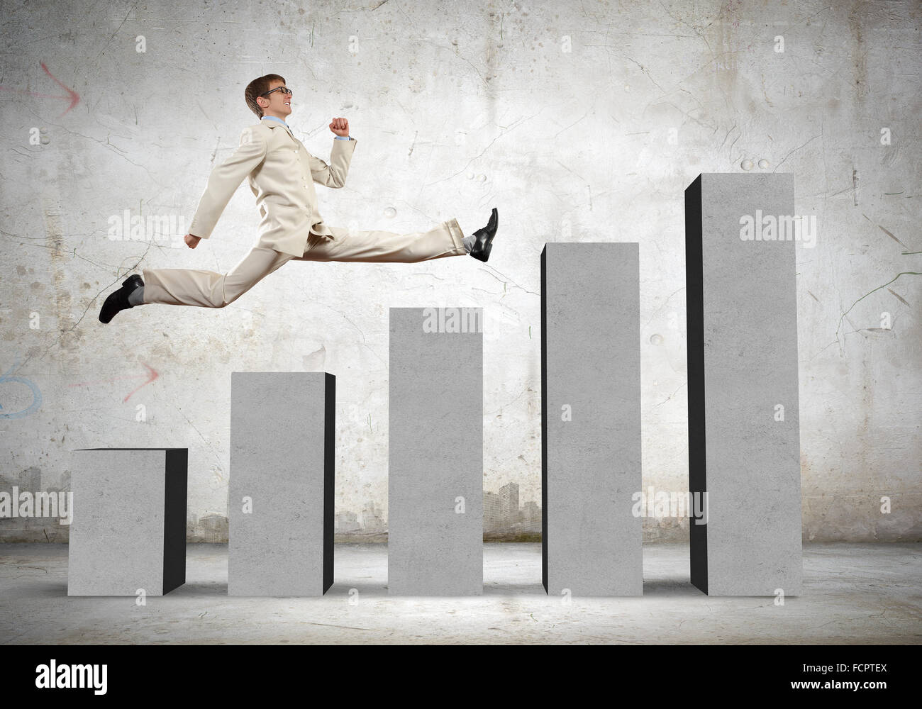 Young businessman stepping up on chart bar Stock Photo - Alamy