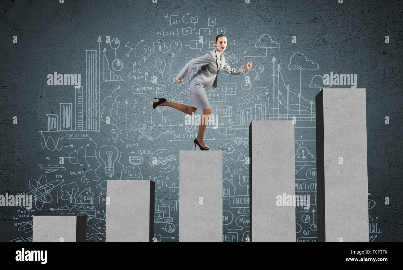 Young businesswoman stepping up on chart bar Stock Photo - Alamy