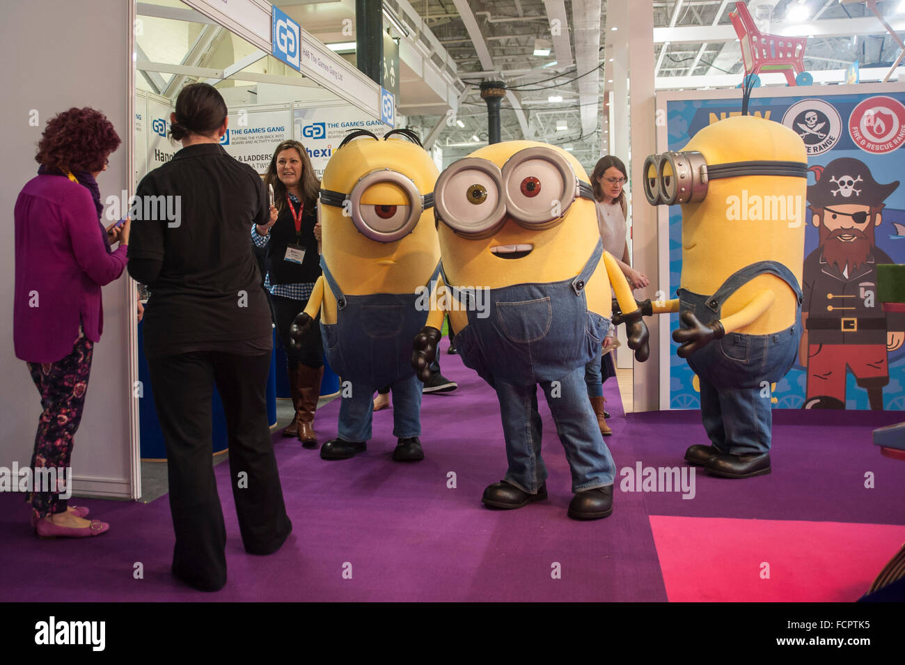 London, UK. 24 January 2016. Characters dressed as Minions pass by, as ...