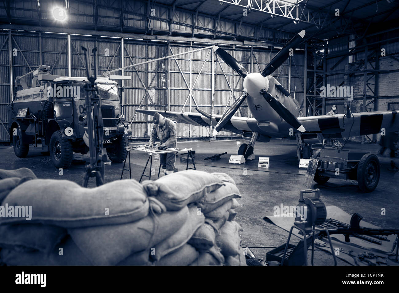 A recreated scene from world war two of an active Spitfire hangar as ...