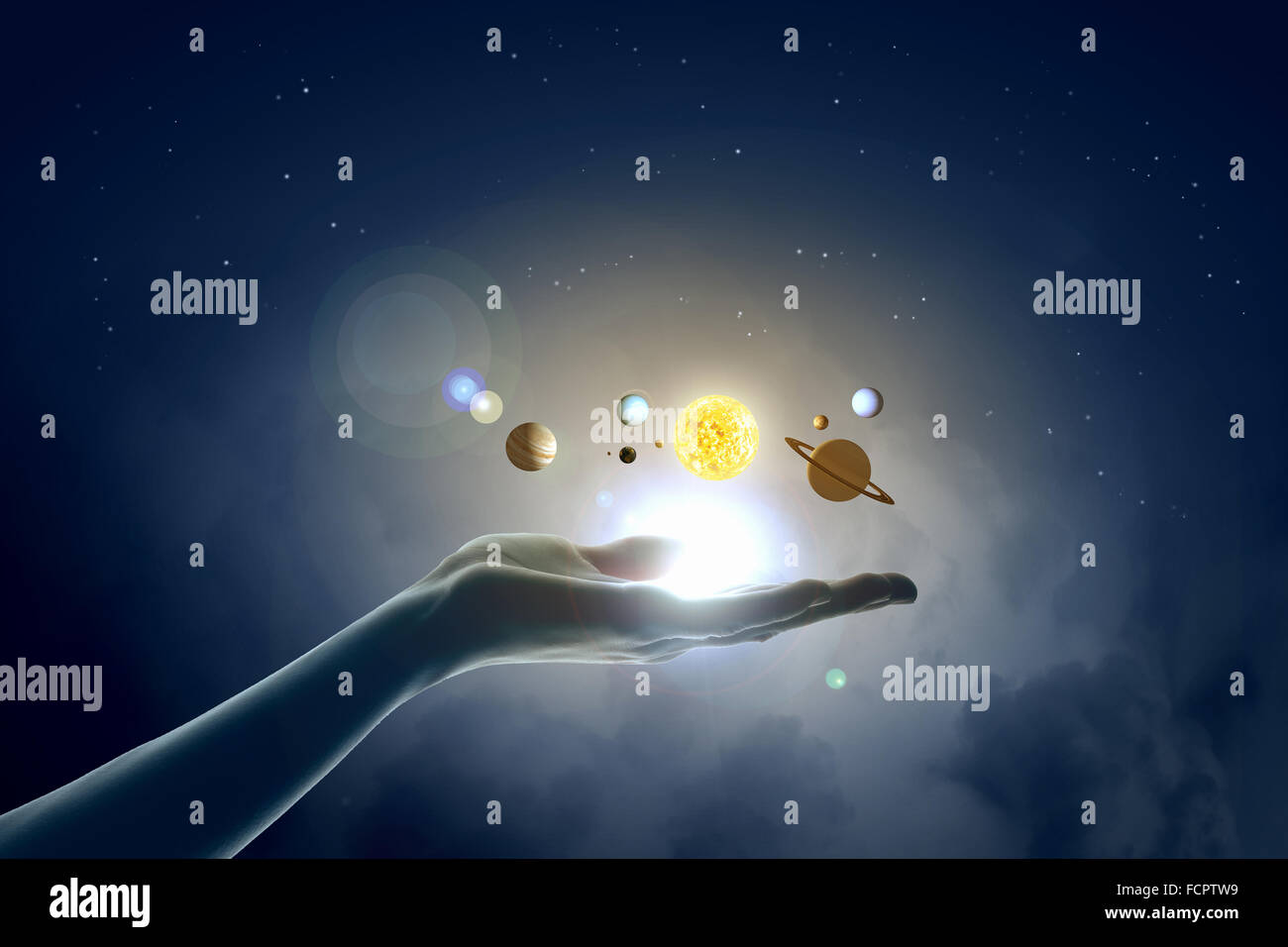 Close up of planet sun system in your hand Stock Photo - Alamy