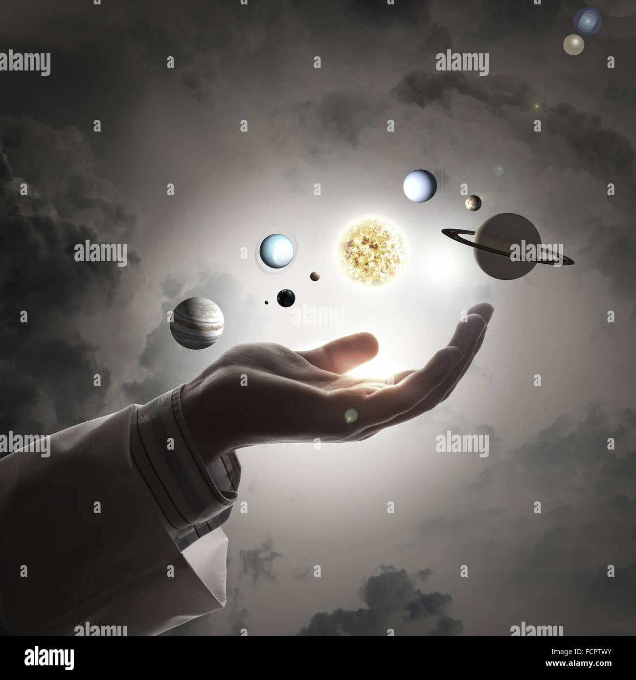 Close up of planet sun system in your hand Stock Photo - Alamy