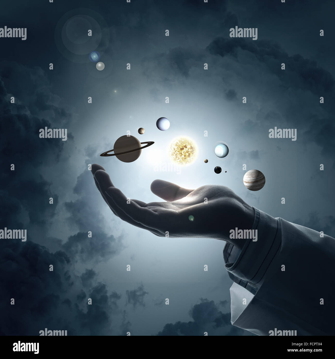 Close up of planet sun system in your hand Stock Photo - Alamy