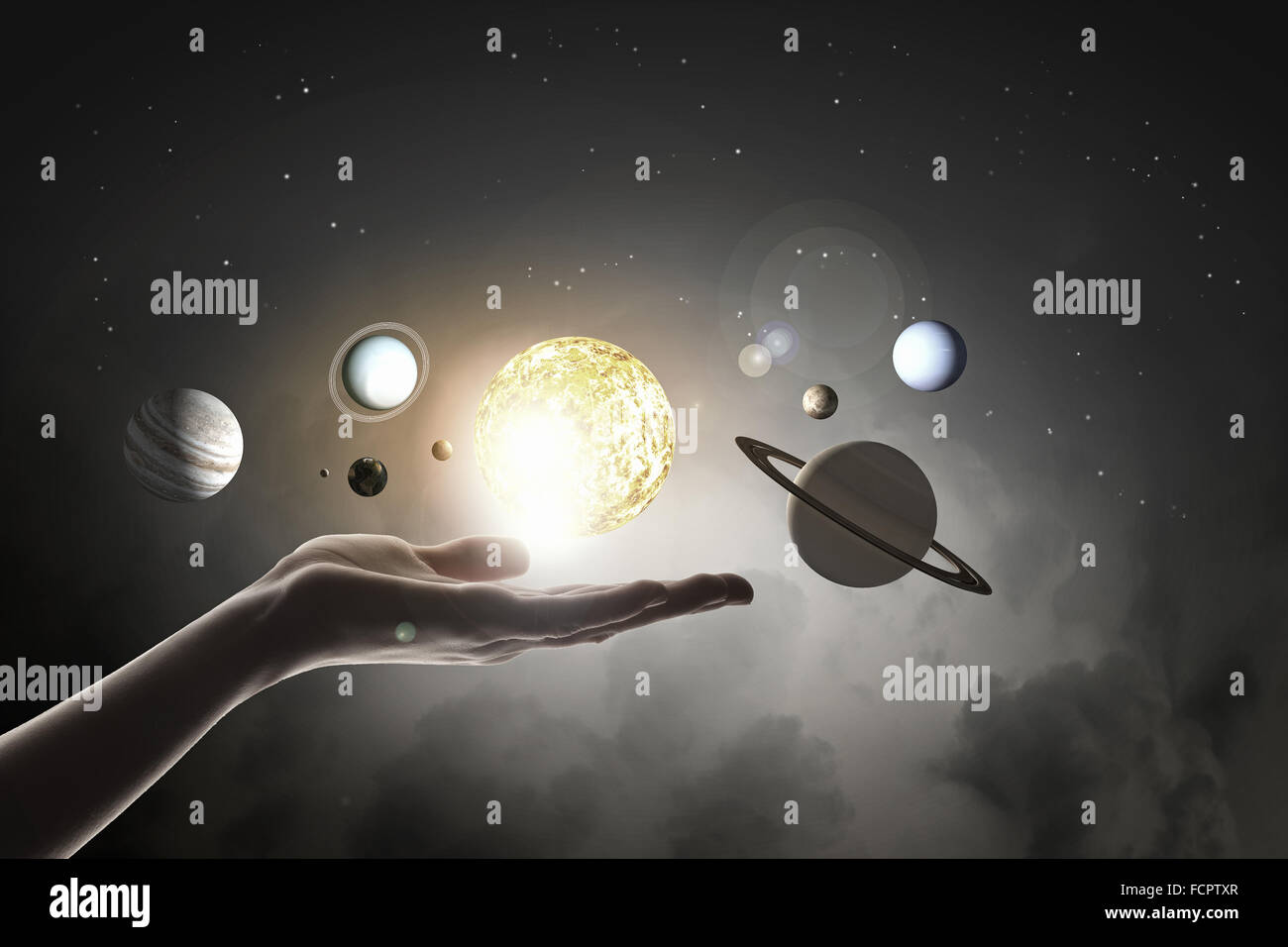 Close up of planet sun system in your hand Stock Photo - Alamy