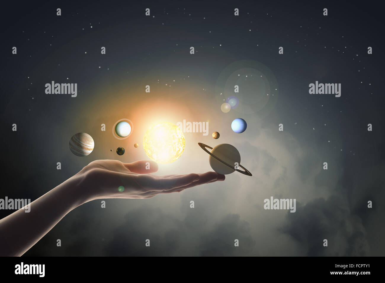 Close up of planet sun system in your hand Stock Photo - Alamy