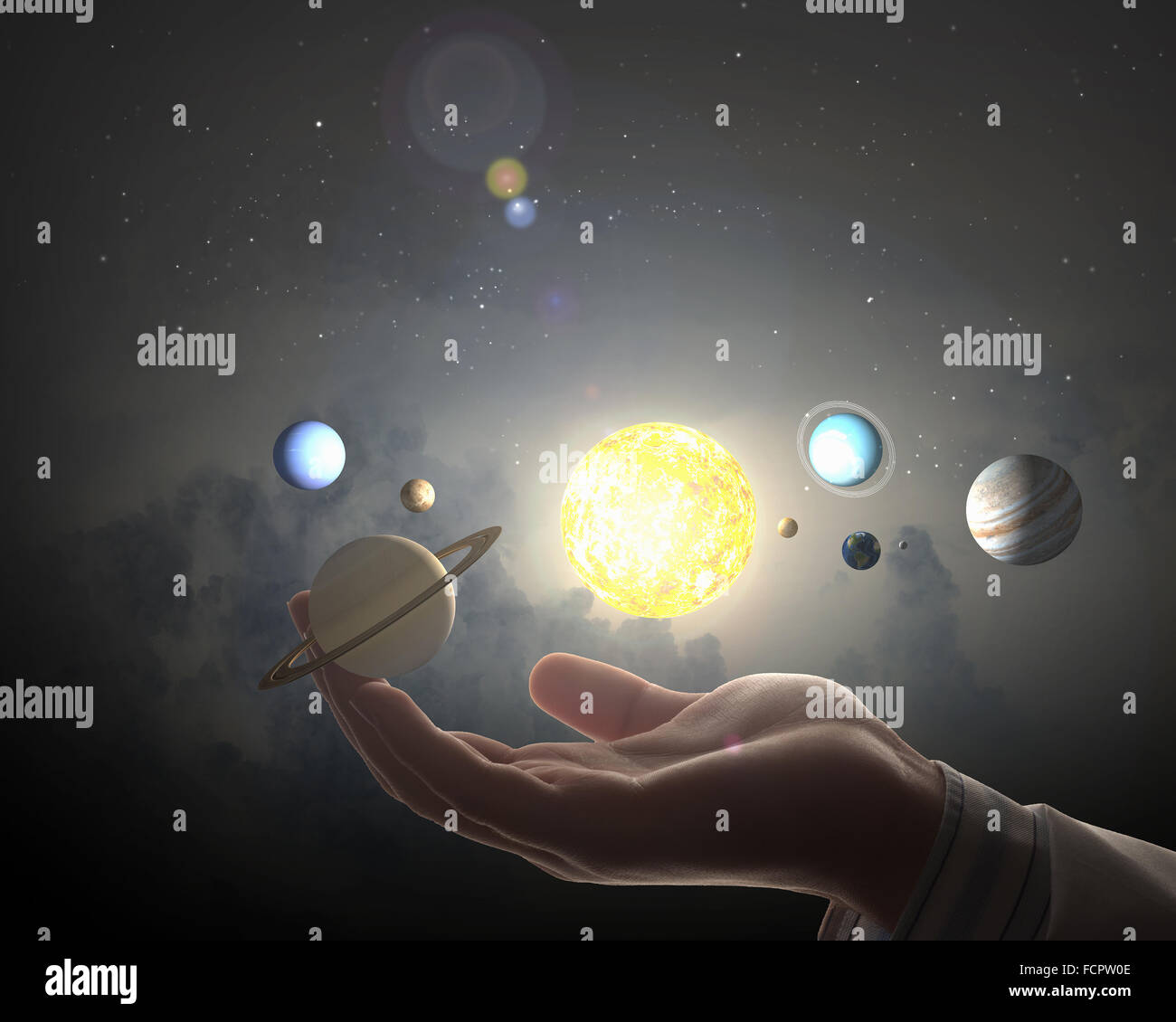 Close up of planet sun system in your hand Stock Photo - Alamy